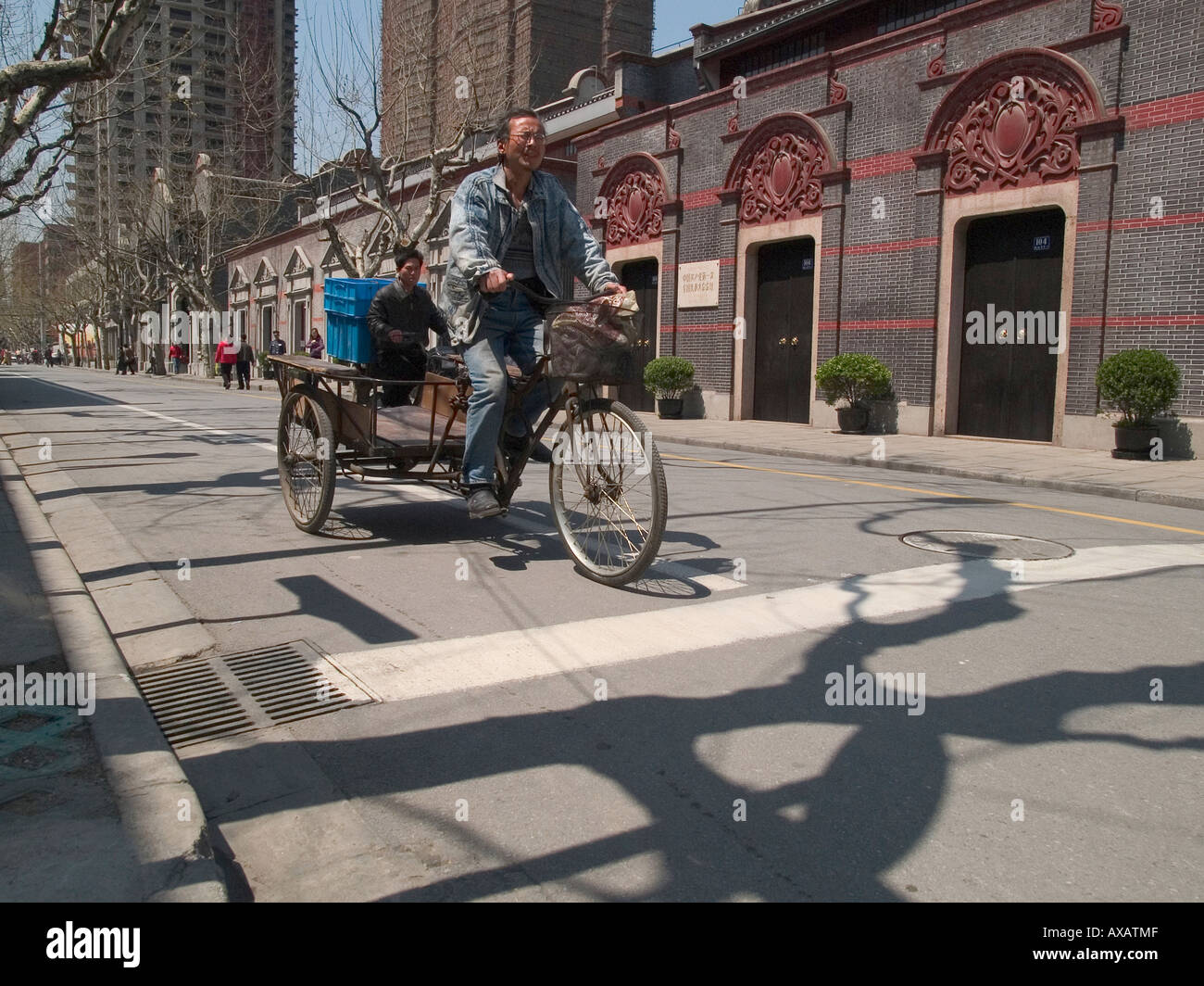 Man riding bike, Shanghai, China Stock Photo - Alamy
