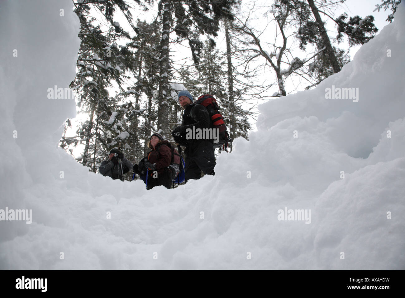 Hikers snowshoeing on the Hancock Notch Trail during the winter months ...