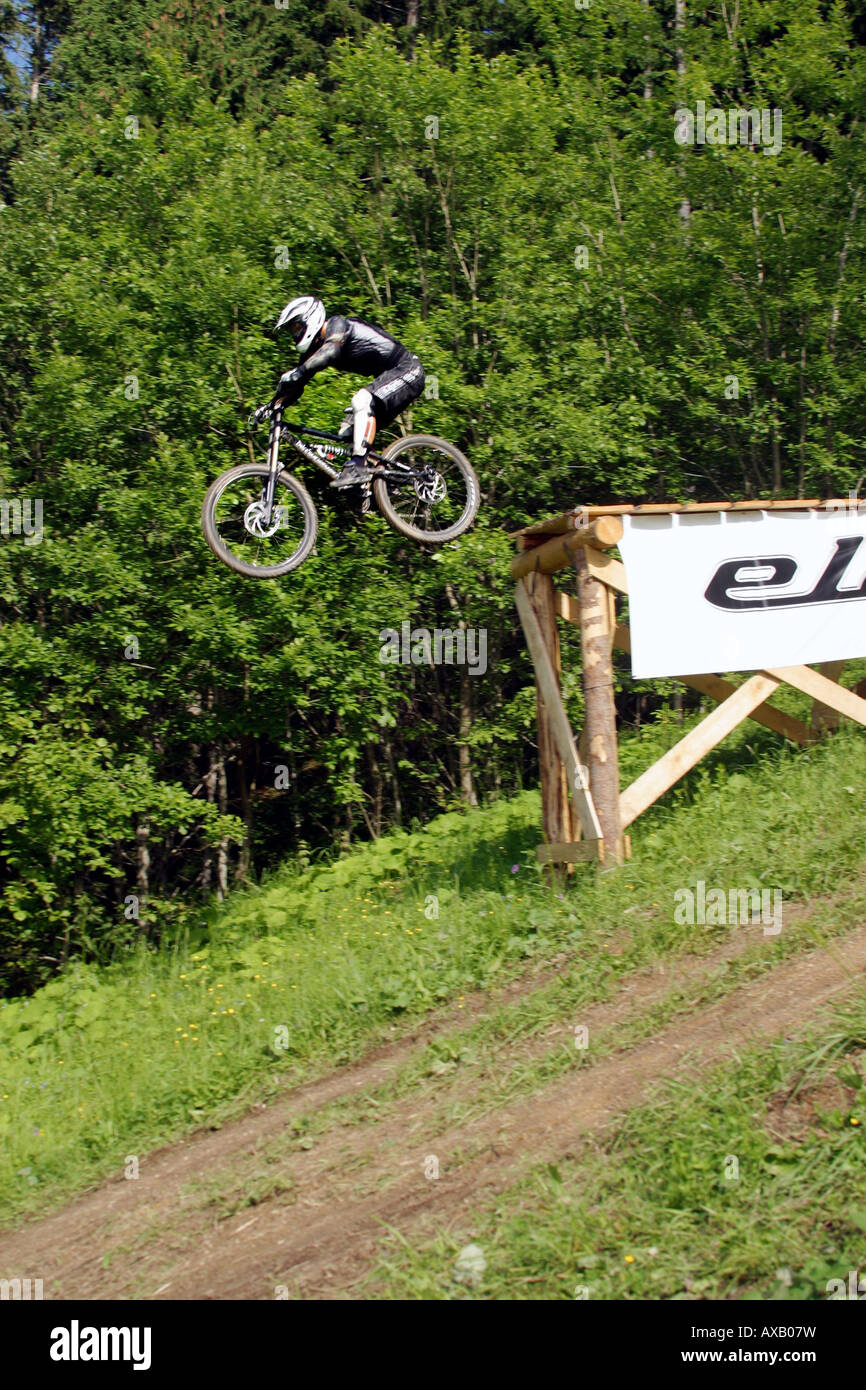 Jump at downhill biking Stock Photo - Alamy