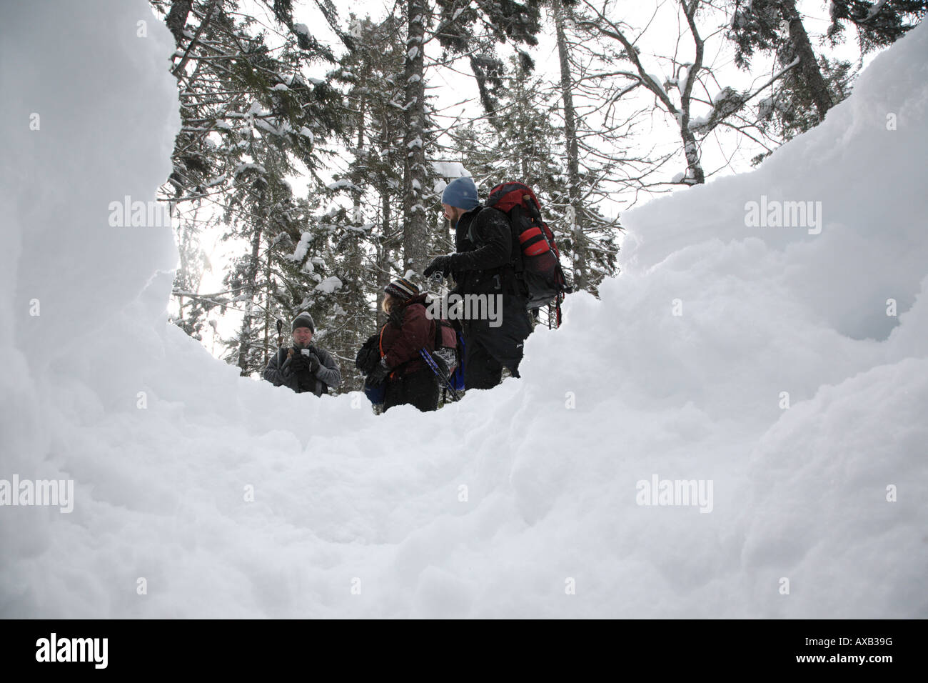 Hikers snowshoeing on the Hancock Notch Trail during the winter months ...