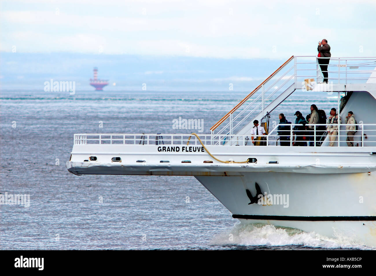 A "Croisières AML" whale watching cruising ship passing by on the St ...