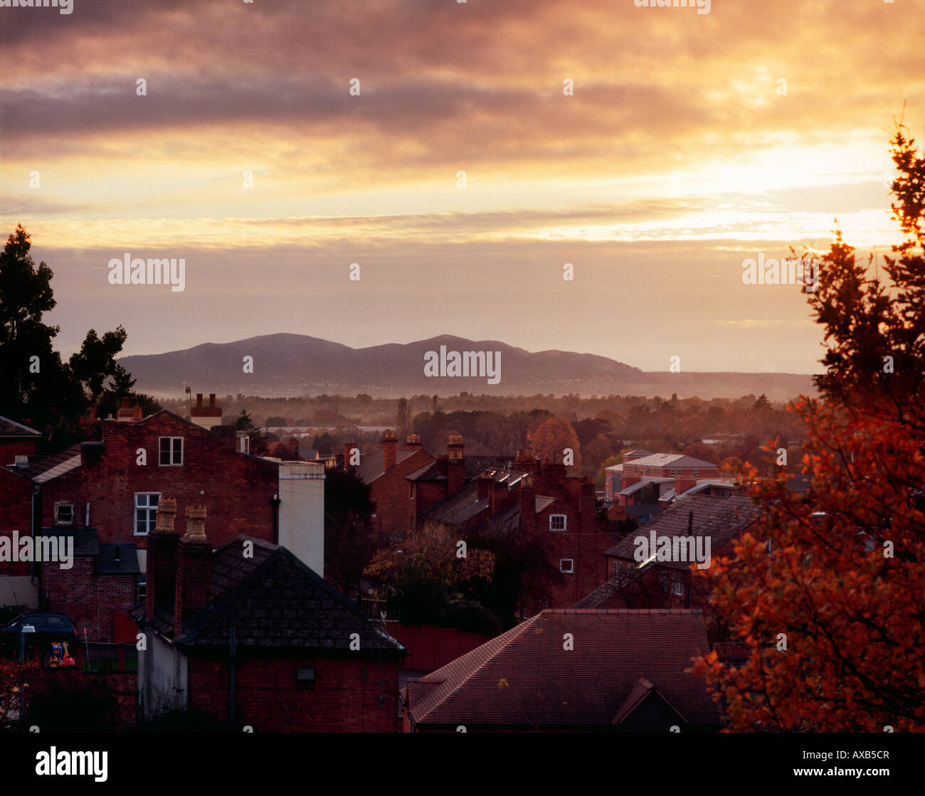 The Malvern Hills seen across Worcester rooftops Stock Photo - Alamy