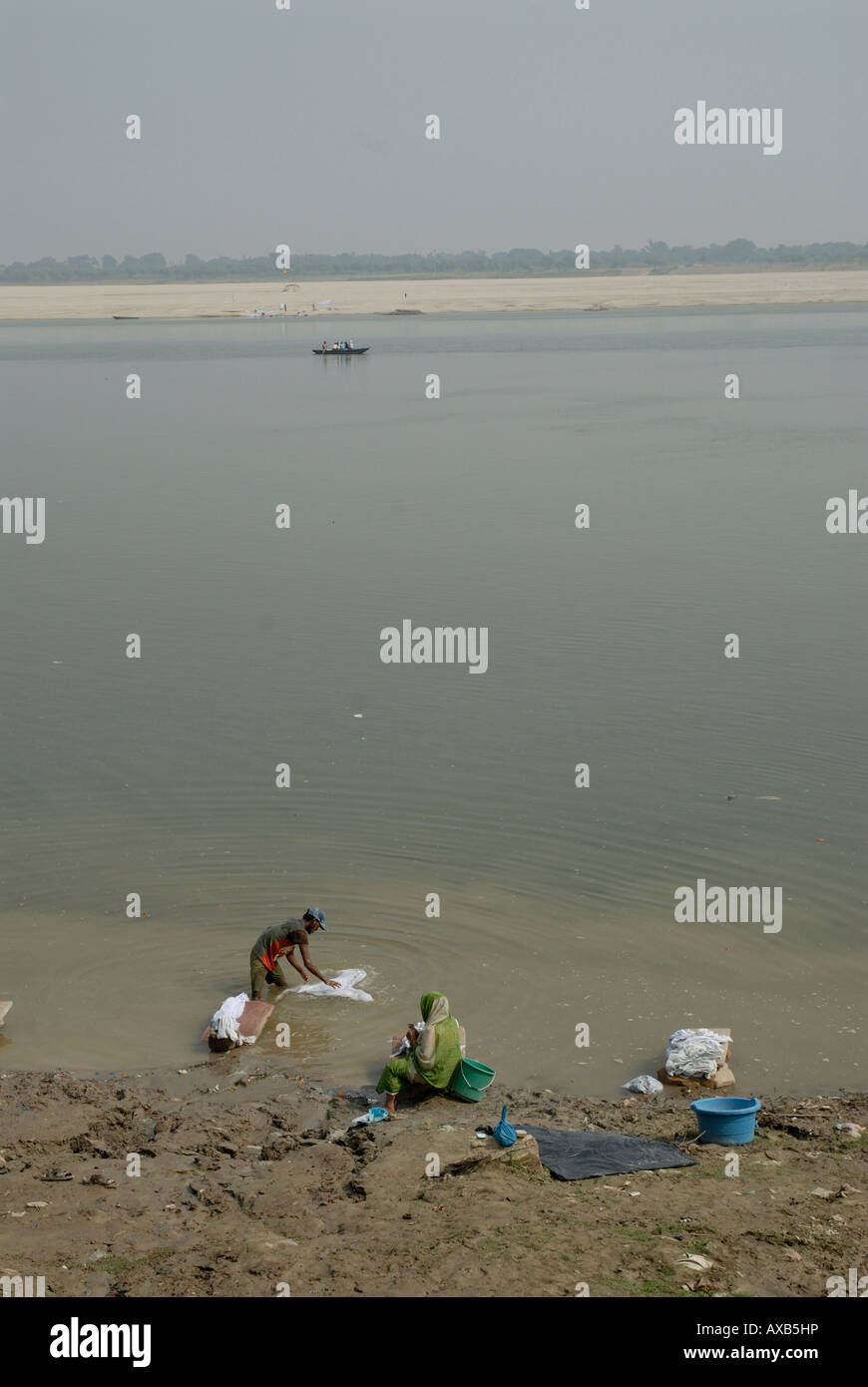 Mens washing clothes and laundry in the Ganges River Varanasi India ...