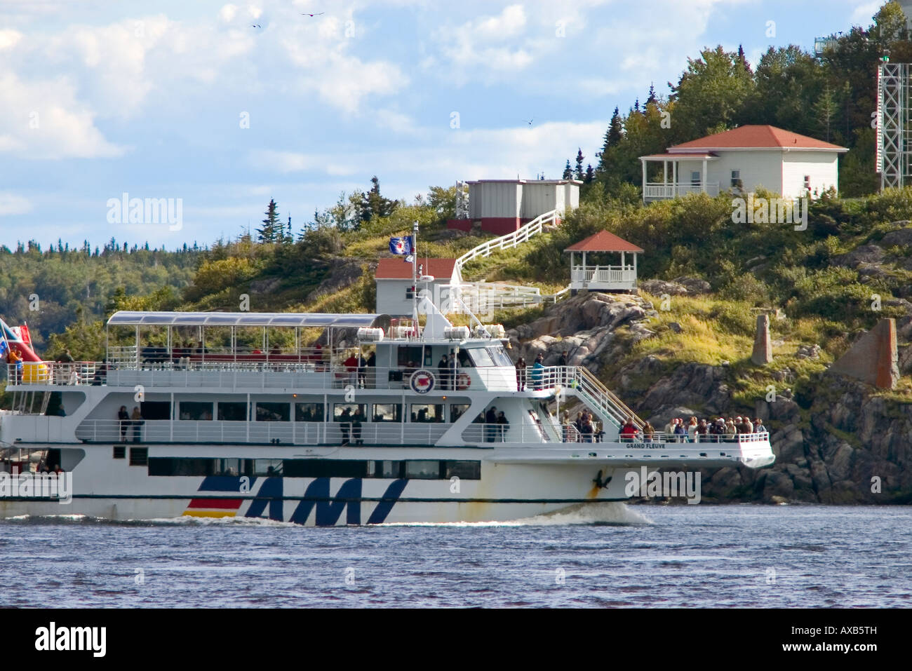 A "Croisières AML" whale watching cruising ship passing by on the ...