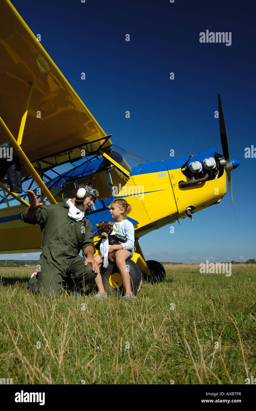 A father private pilot with his young daughter around a famous Piper J ...