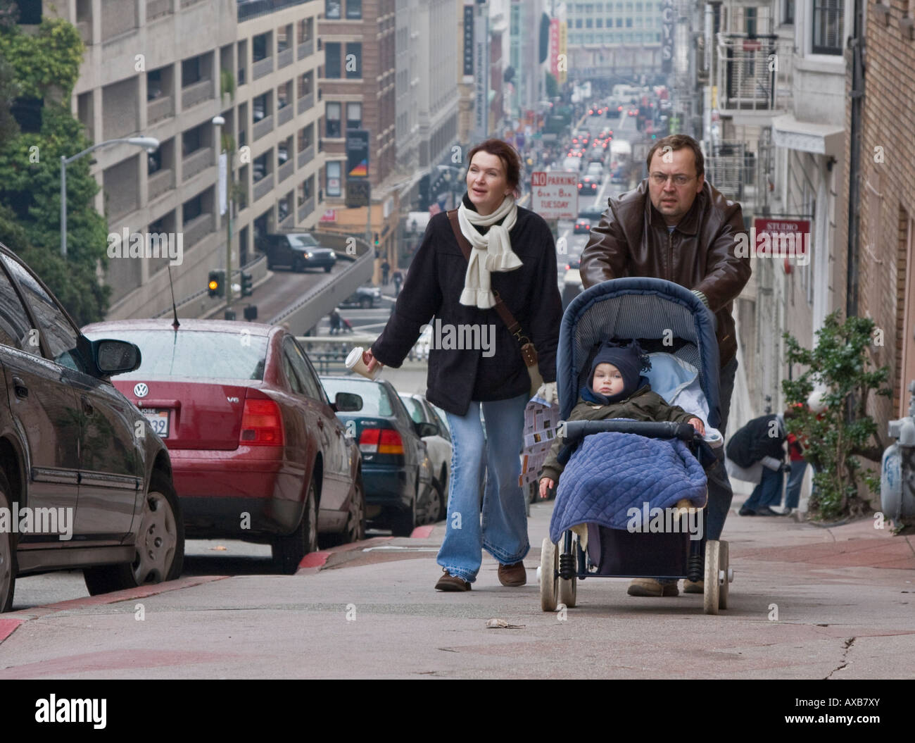 Father pushing a stroller on a hilly San Francisco street Stock Photo ...