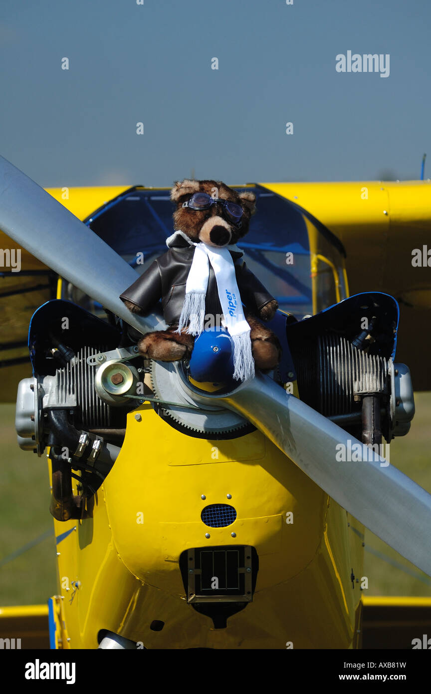 Pilot teddy bear "Cub" seated on the famous "cub" plane propeller, the ...