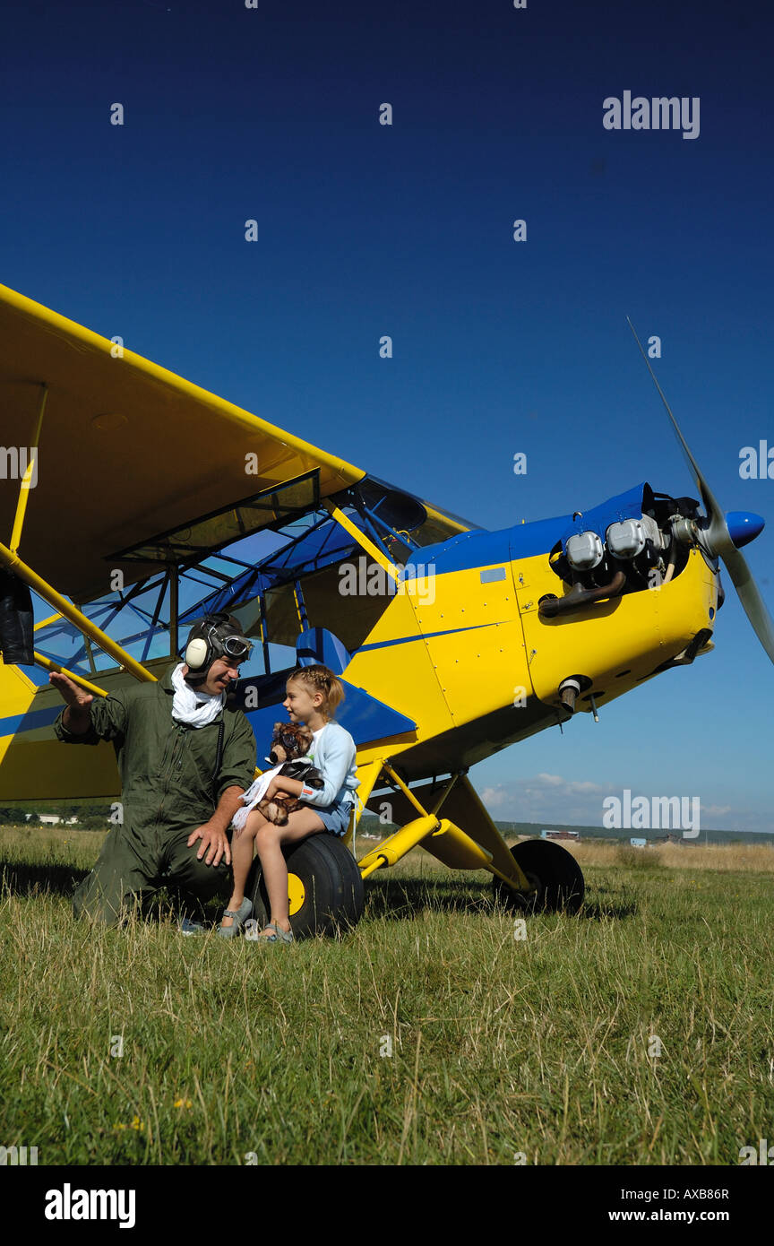 A father private pilot with his young daughter around a famous Piper J ...