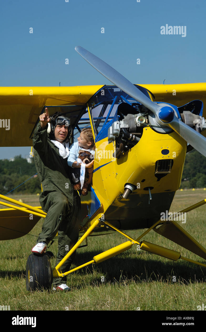A father private pilot with his young daughter in the famous Piper J-3 ...