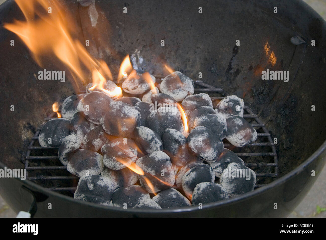 charcoal grill flame up Stock Photo - Alamy