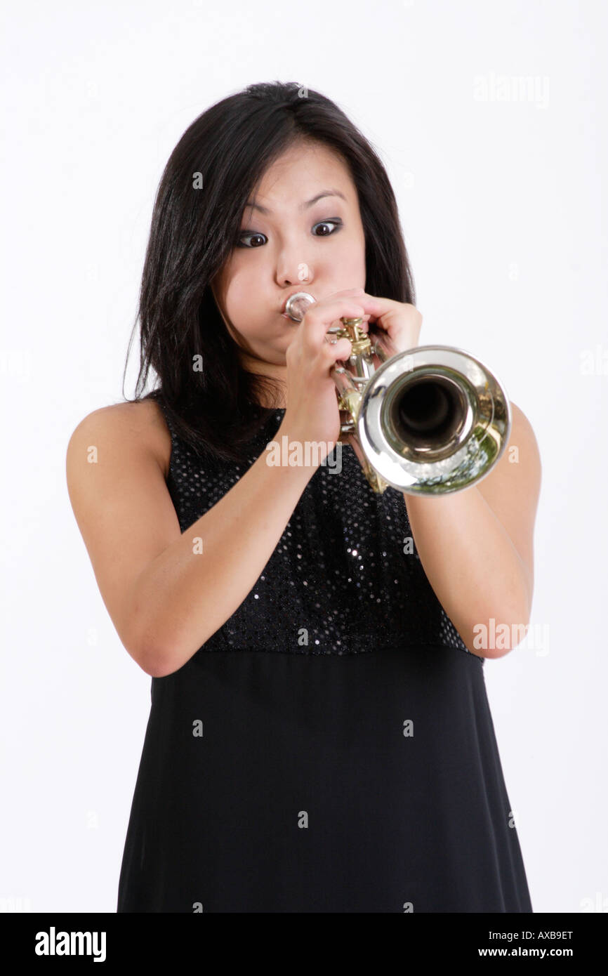 Stock Photograph of a Asian teenager playing the trumpet Stock Photo ...