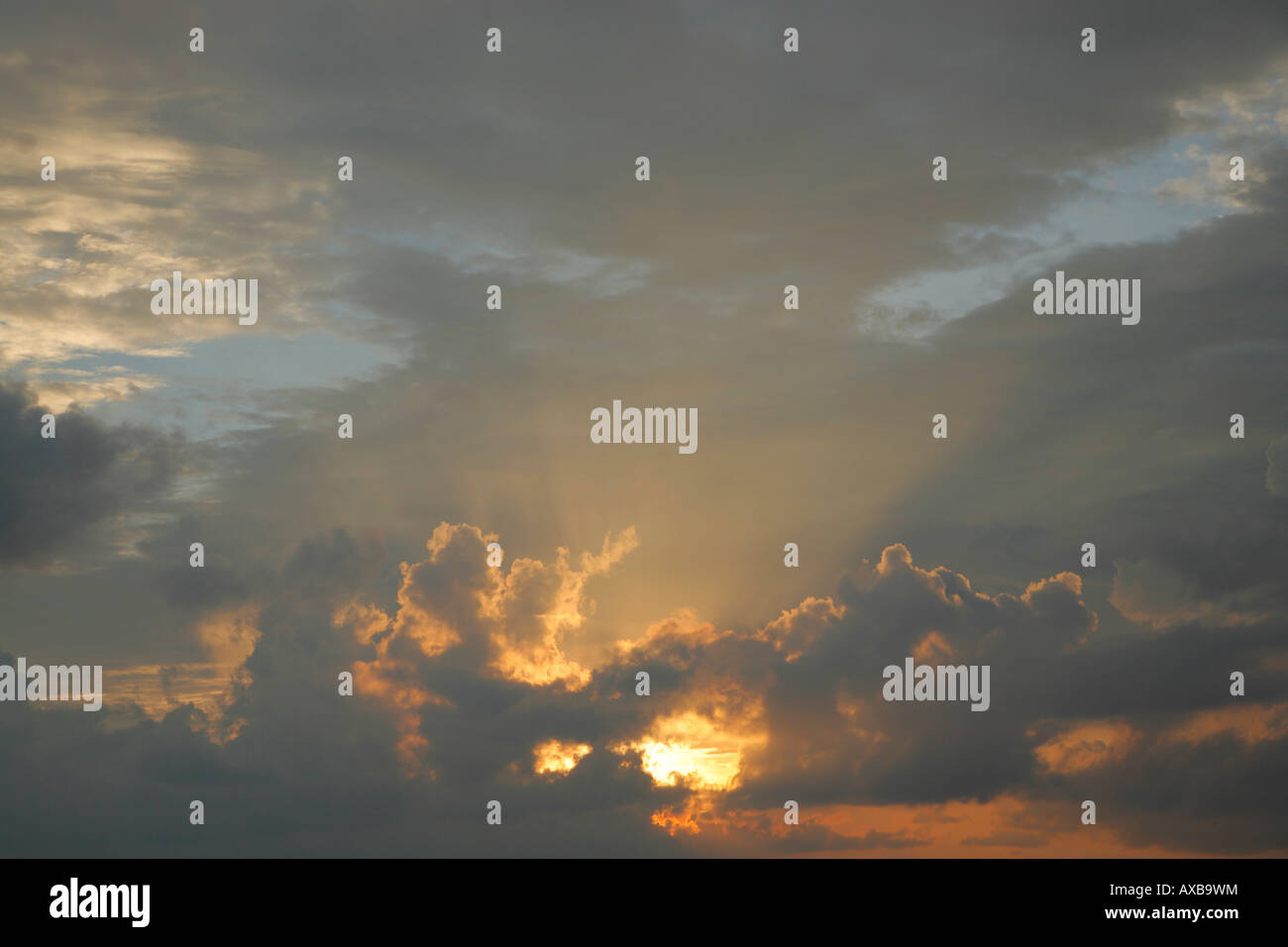 Sun rays bursting through clouds hi-res stock photography and images ...