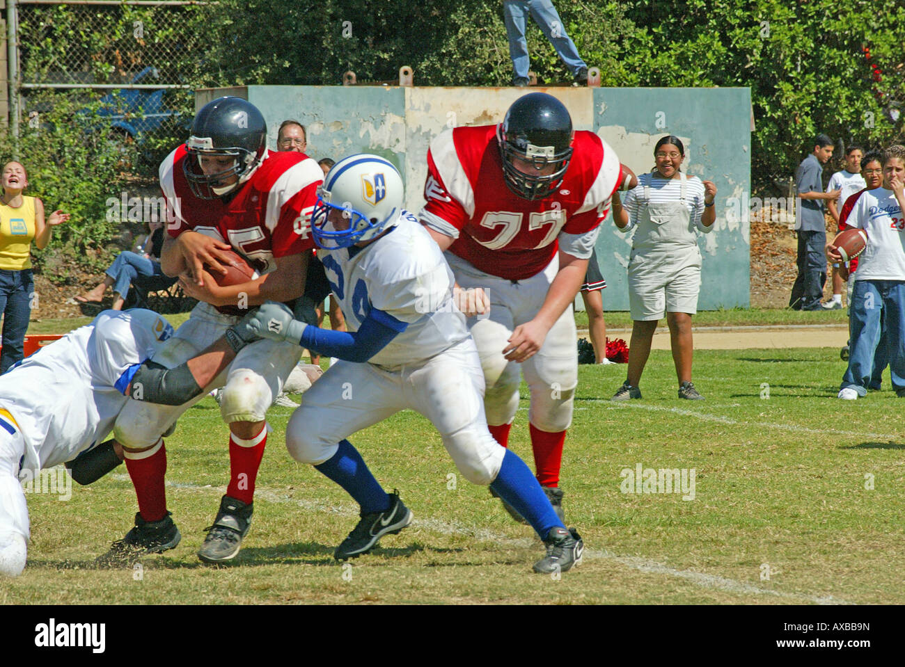 High school football game action Stock Photo - Alamy