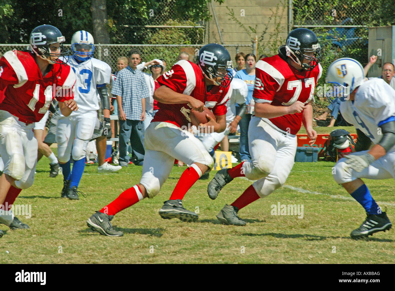 High school football game action Stock Photo - Alamy