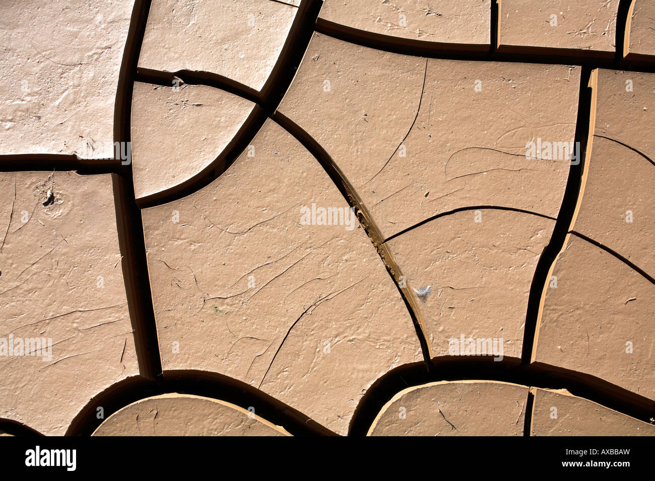 Cracks in dried mud at the bottom of a pond Stock Photo - Alamy