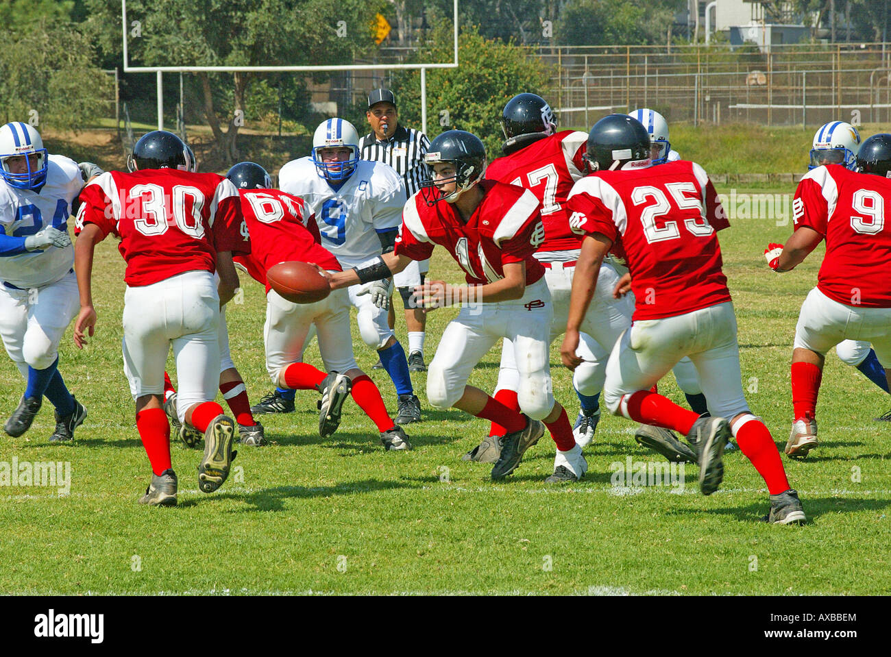 High school football game action Stock Photo - Alamy