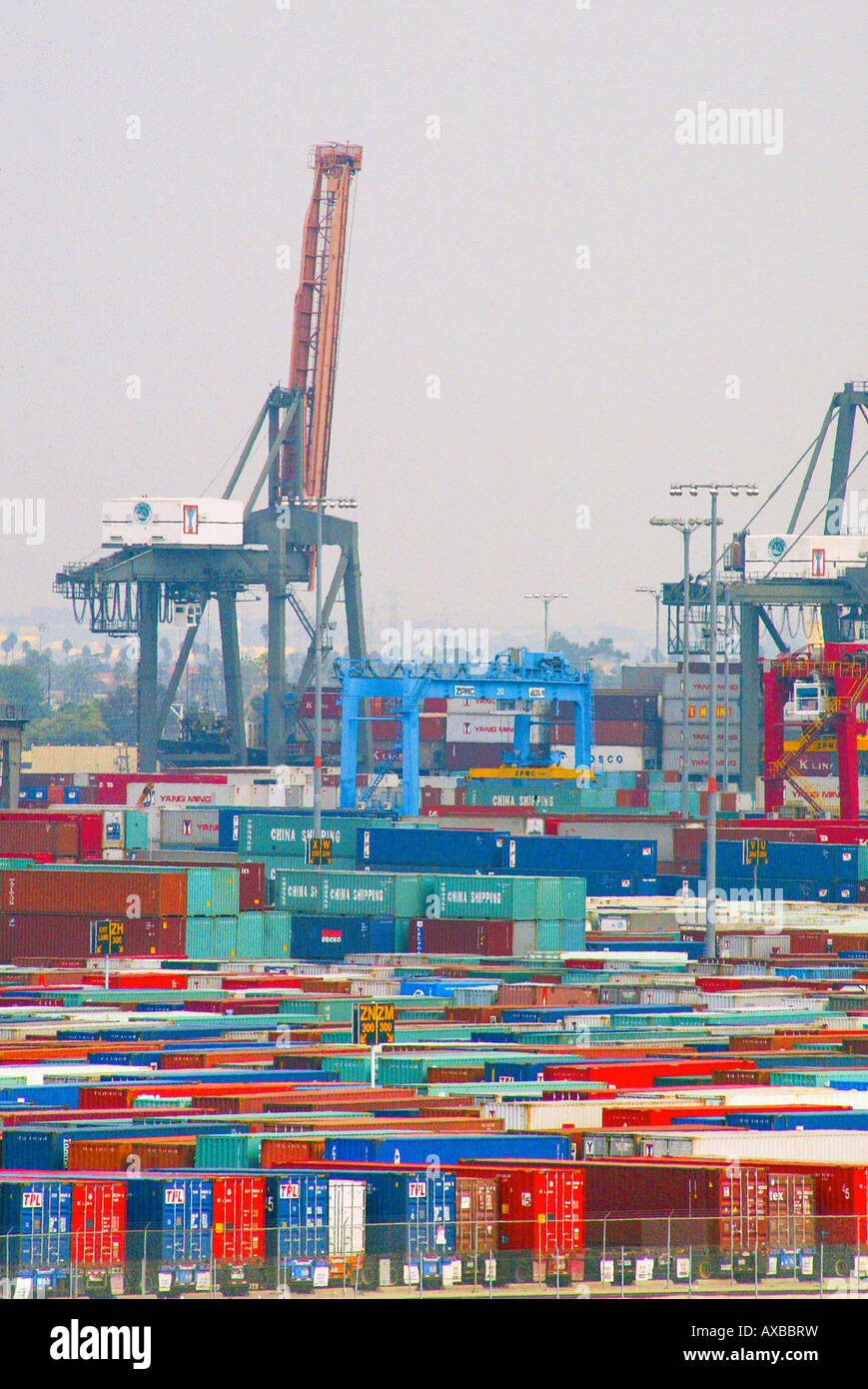 Trucks, cargo containers, ships load and unload in Los Angeles Harbor ...