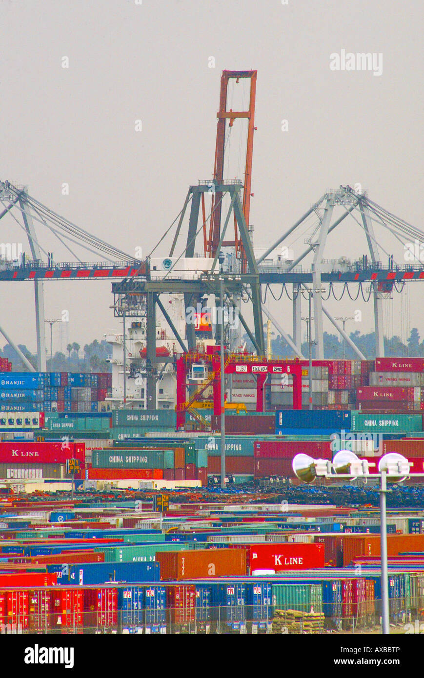 Trucks, cargo containers, ships load and unload in Los Angeles Harbor ...