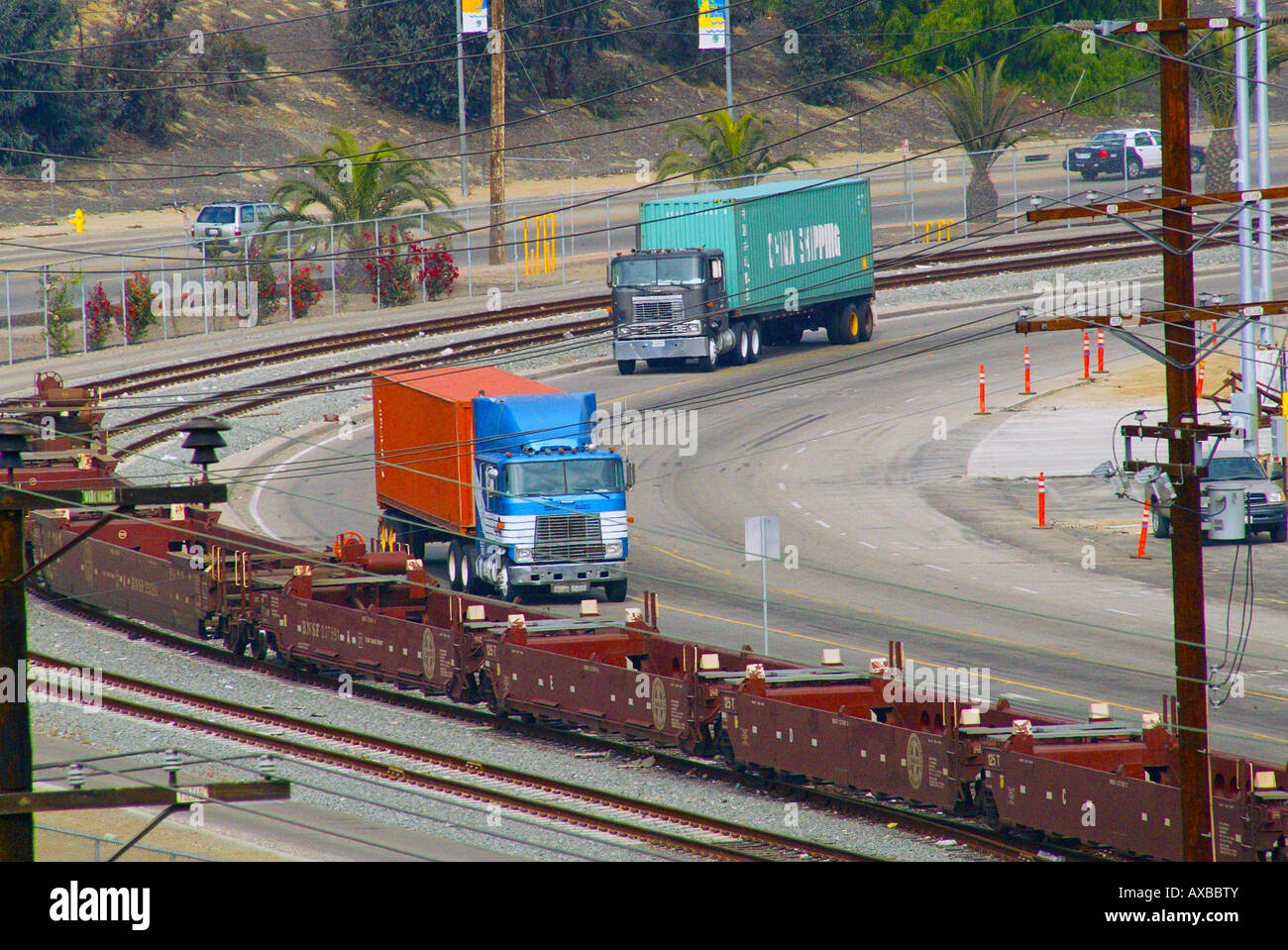 Trucks, cargo containers, ships load and unload in Los Angeles Harbor ...