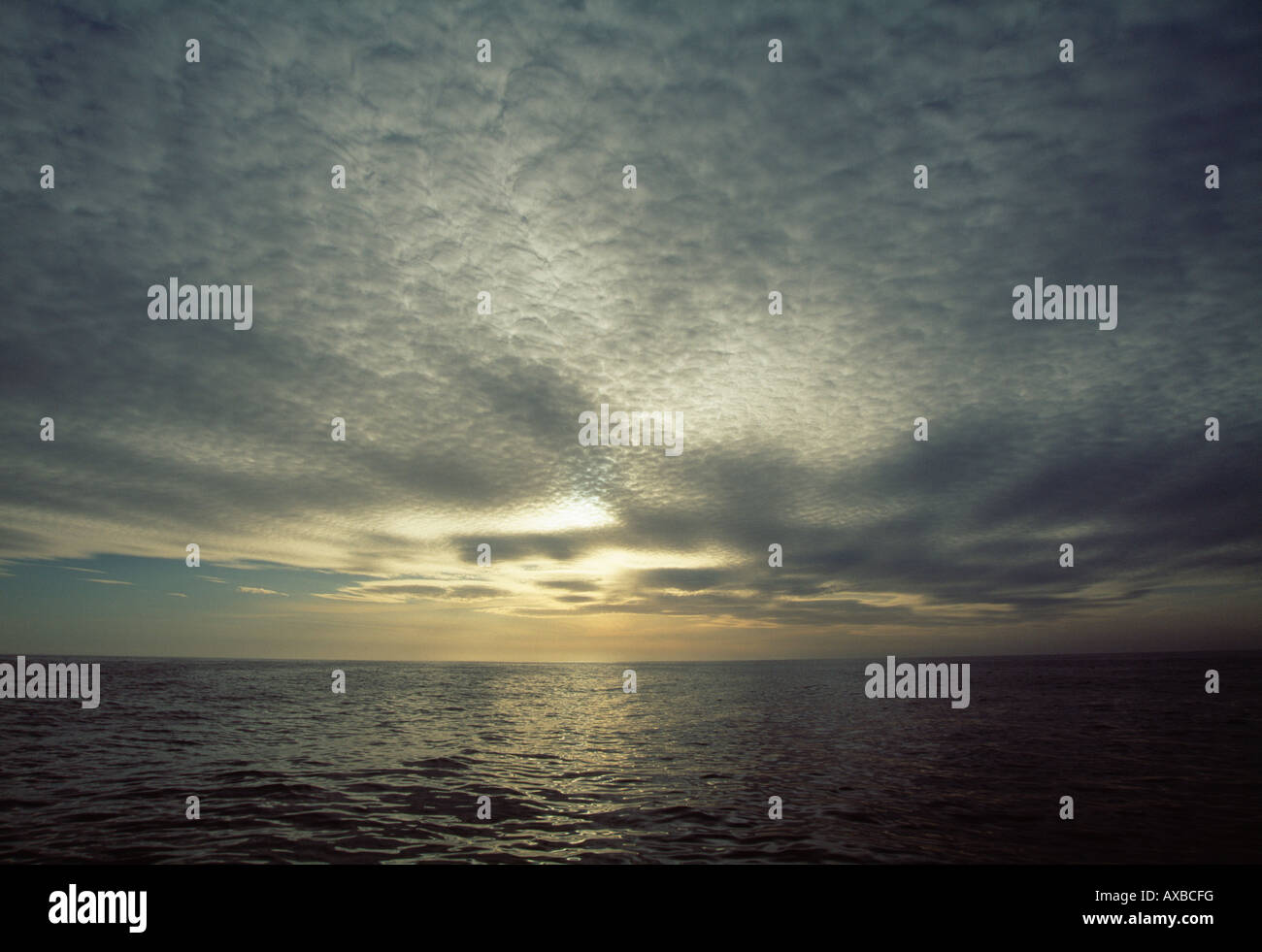 Sunset over the ocean Stock Photo - Alamy
