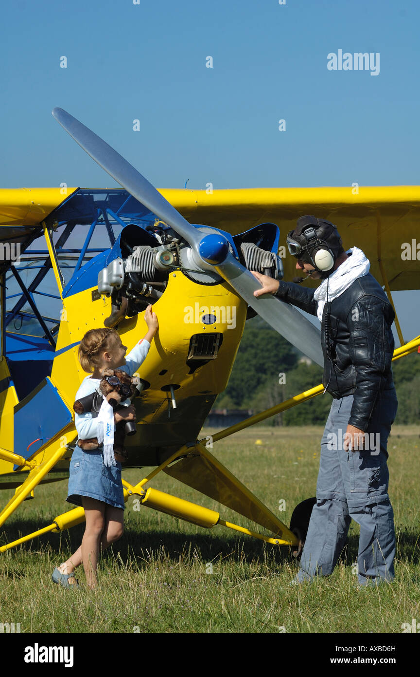 A father private pilot with his young daughter around a famous Piper J ...