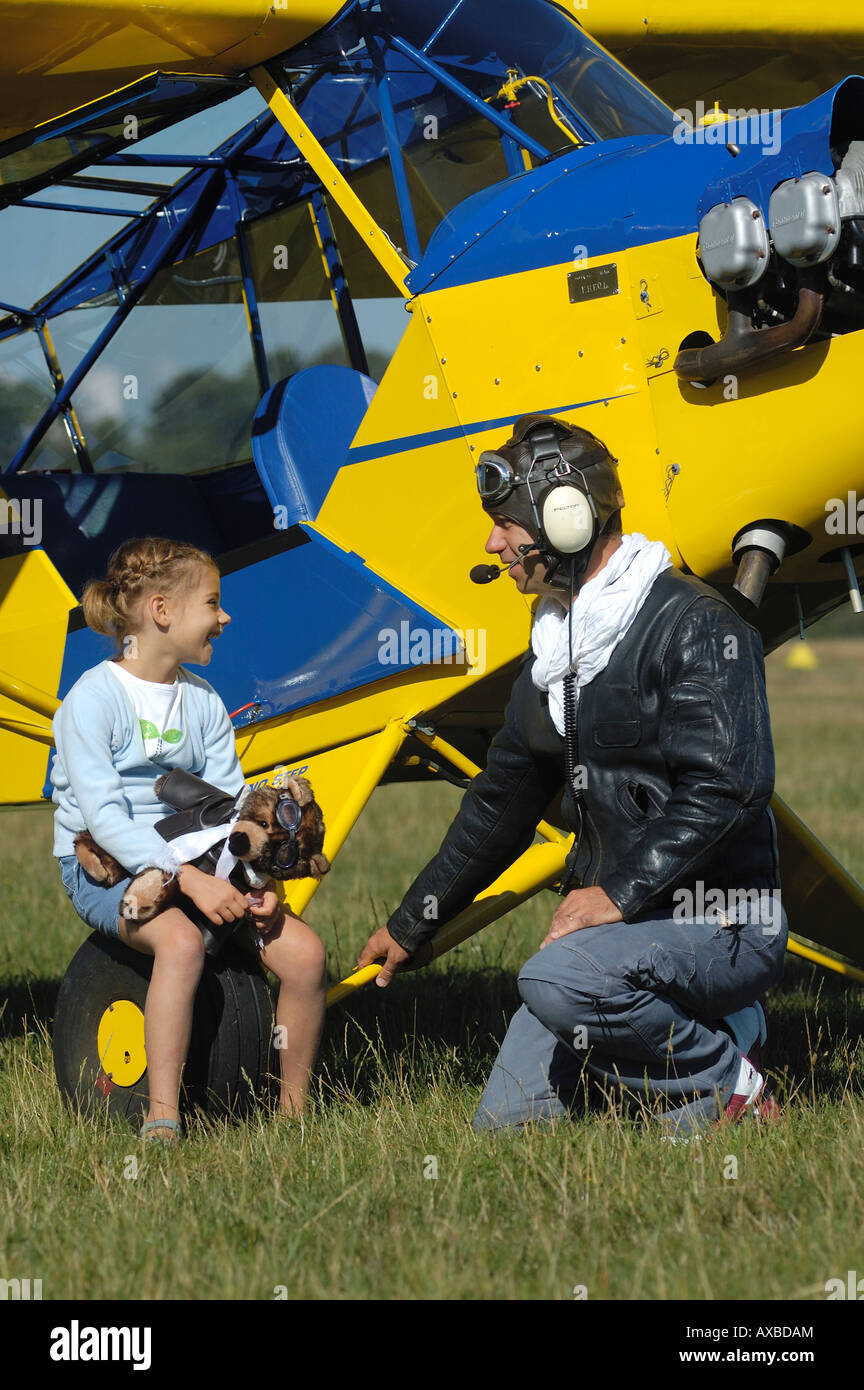 A father private pilot with his young daughter around a famous Piper J ...