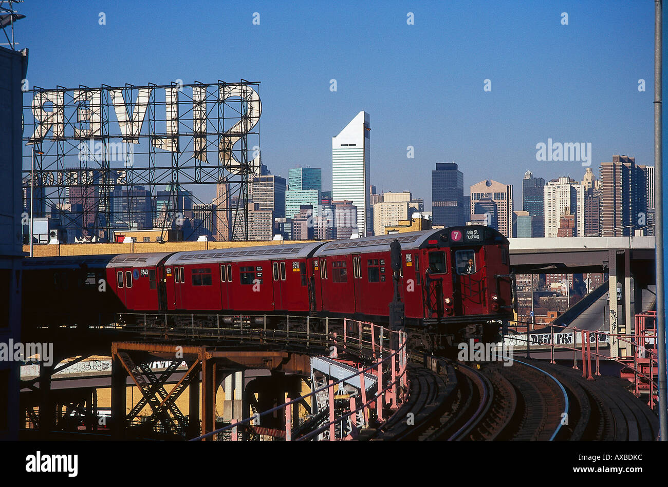 Subway driving on a bridge under clear sky, Queens, Manhattan, New York ...