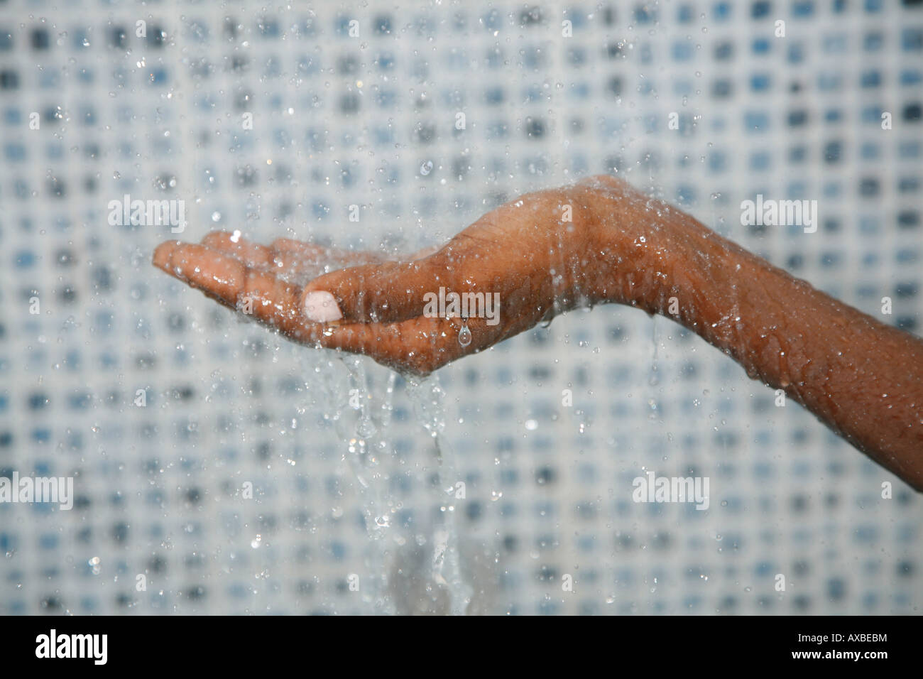 Woman's hand in the shower Stock Photo - Alamy