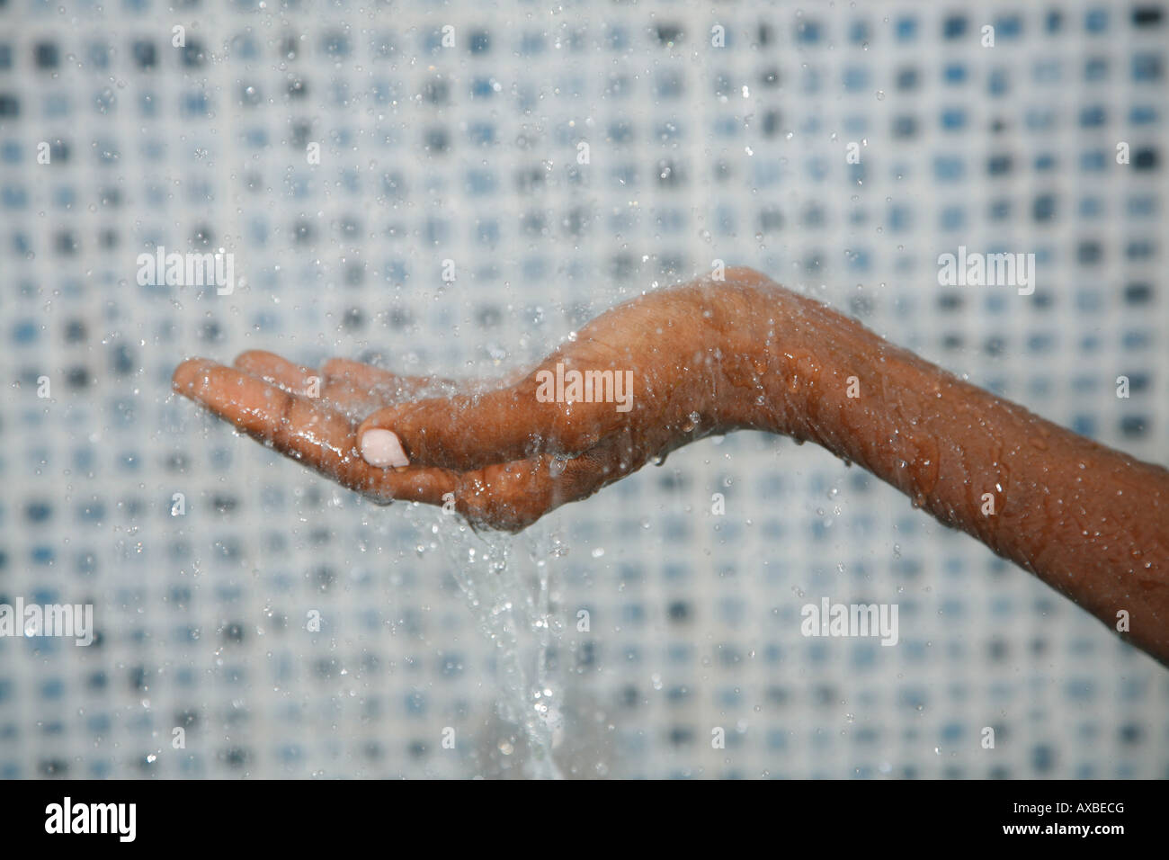Woman's hand in the shower Stock Photo - Alamy