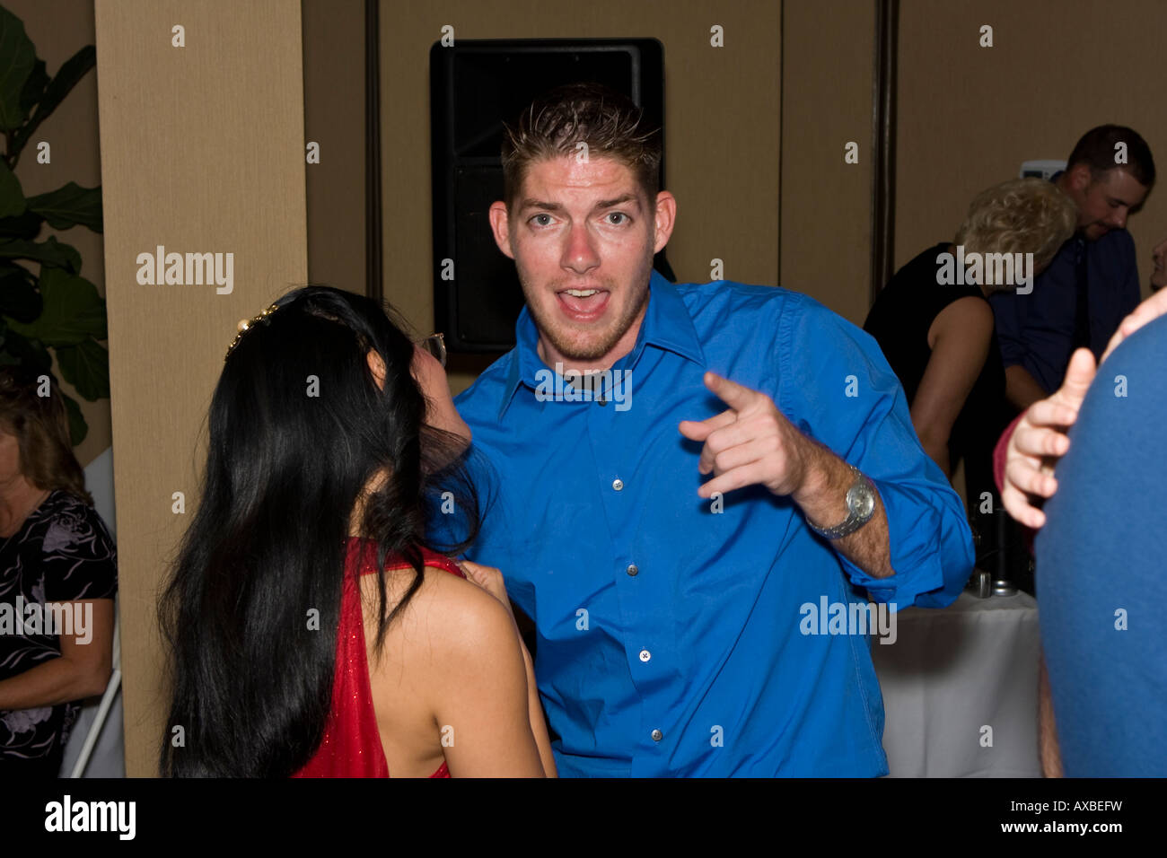 Man and Woman Dancing at Wedding and Pointing Stock Photo - Alamy