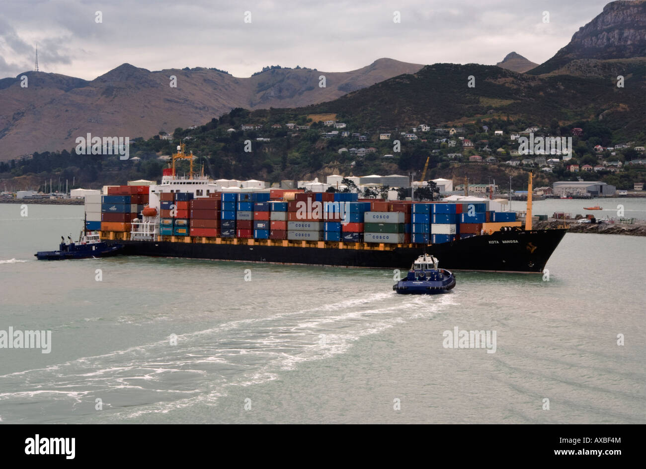 A loaded container ship approaches her berth in this view from another ...