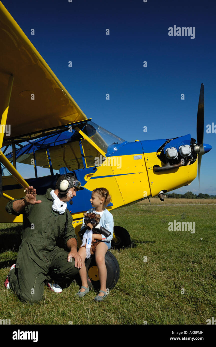 A father private pilot with his young daughter around a famous Piper J ...