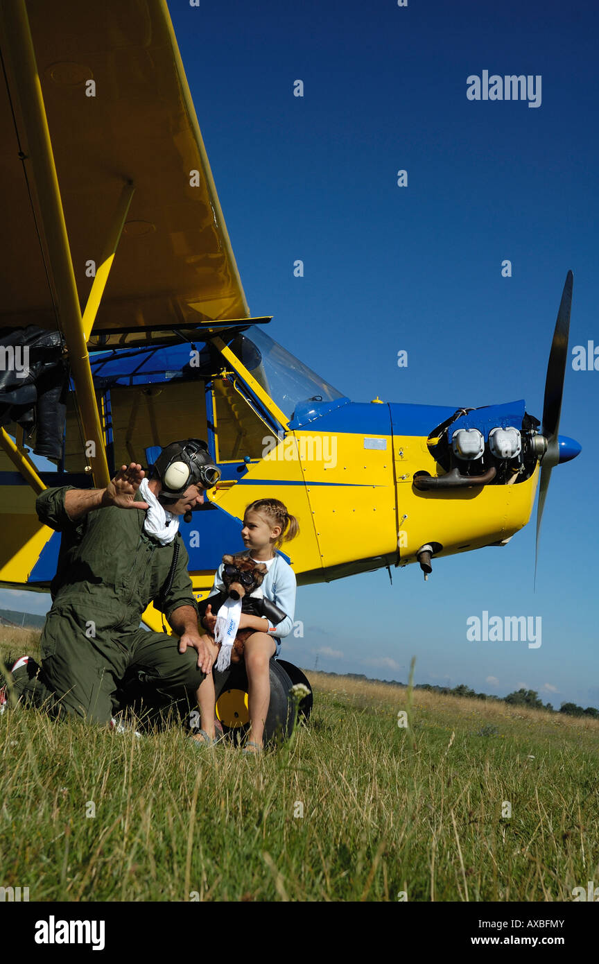 A father private pilot with his young daughter around a famous Piper J ...