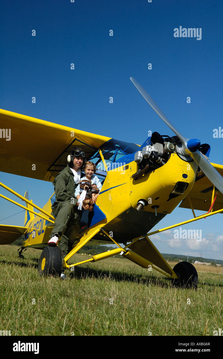 A father private pilot with his young daughter in the famous Piper J-3 ...