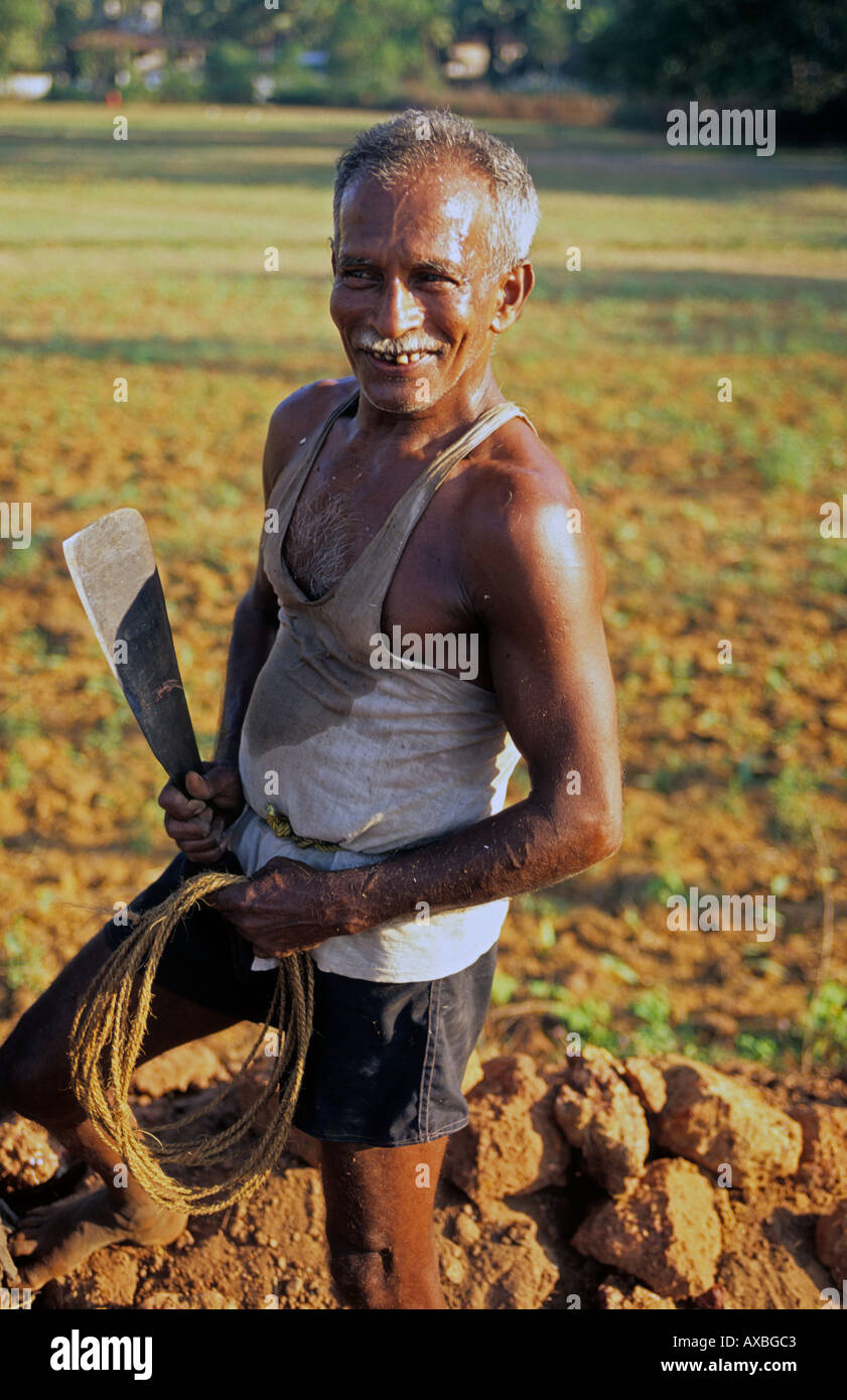 india goa a local man working in the fields Stock Photo - Alamy