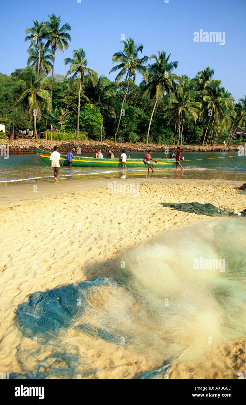 india goa fishermen on baga beach Stock Photo - Alamy