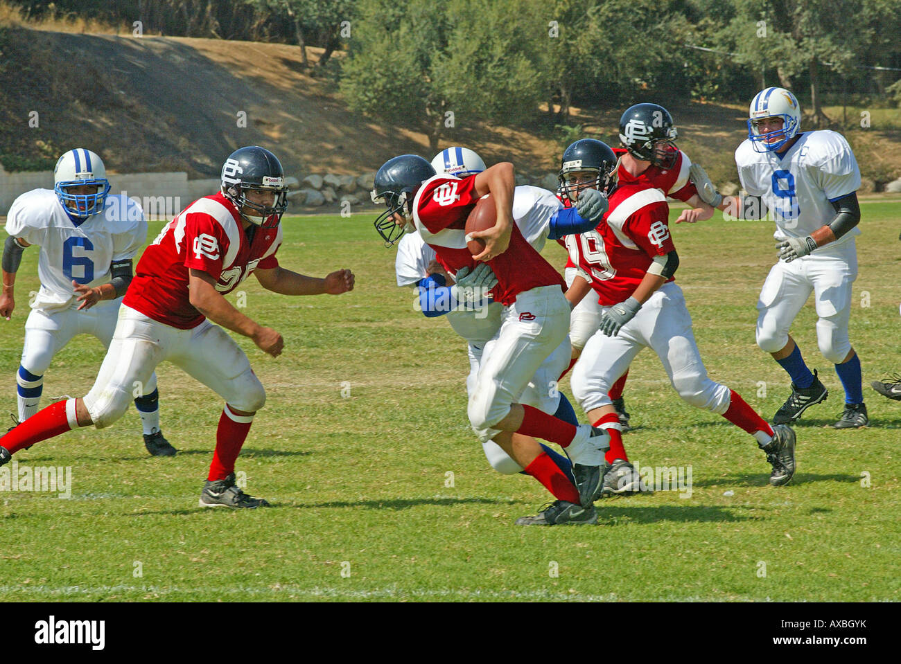 High school football game action Stock Photo - Alamy