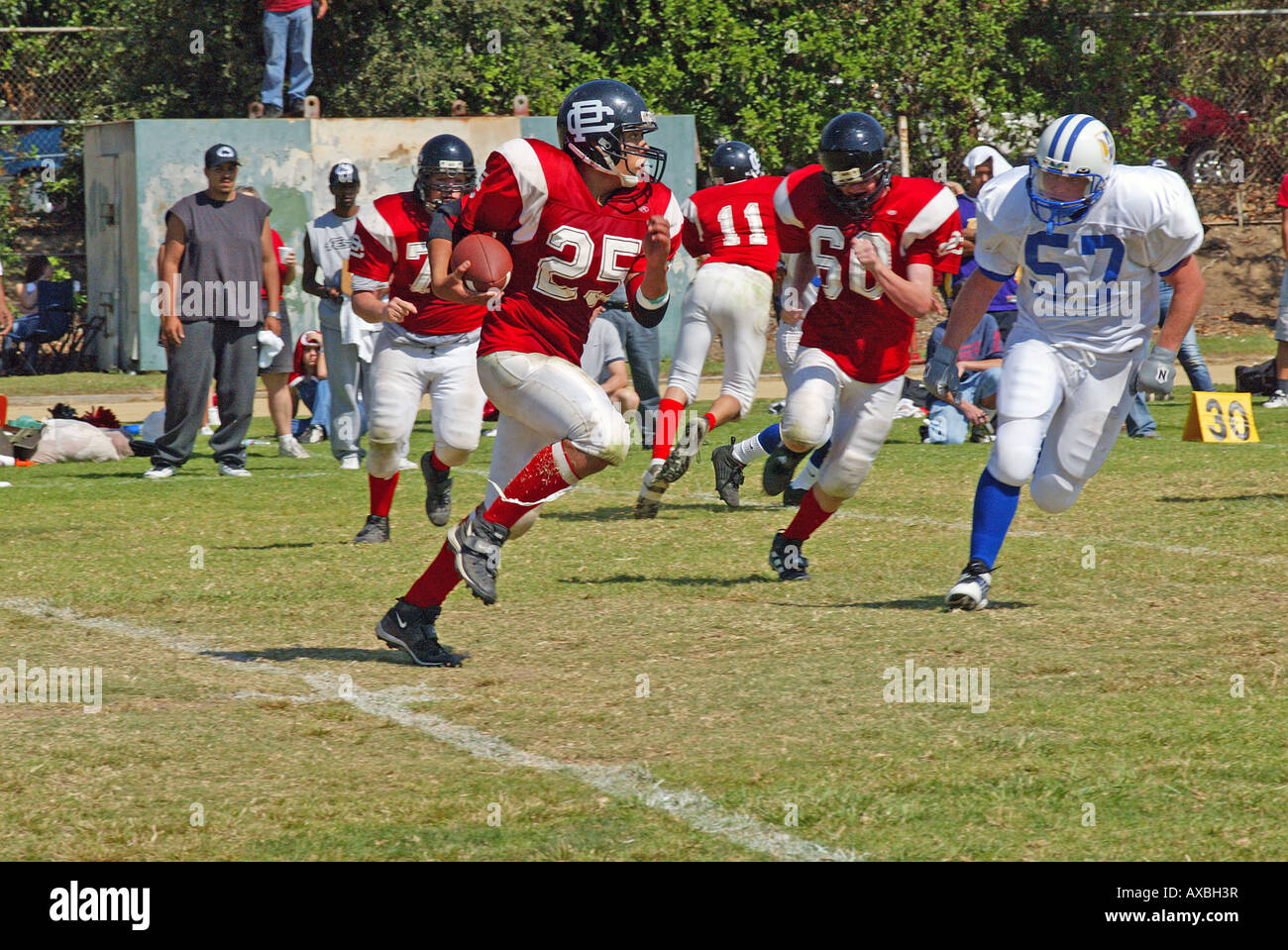 High school football game action Stock Photo - Alamy