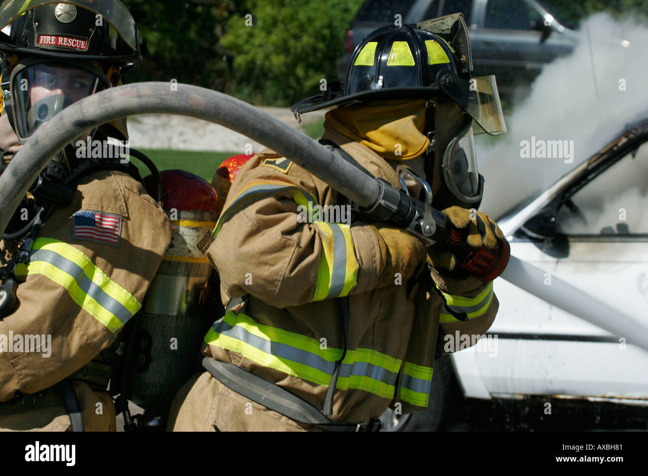 Fire fighters using hi-res stock photography and images - Alamy