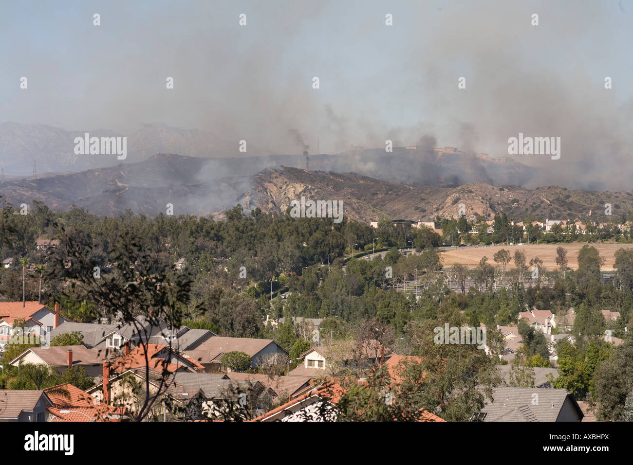 Brush fire in hills of Orange, California threaten homes Stock Photo ...