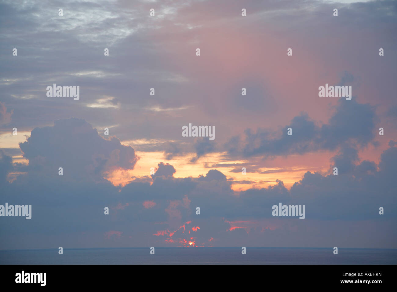 Sun rays bursting through clouds, sunrise, Cancun, Mexico Stock Photo ...