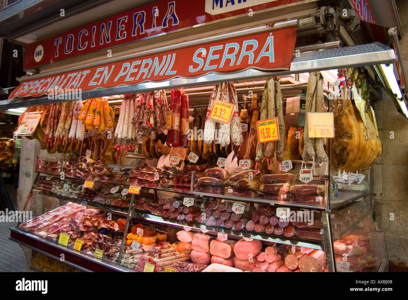 Barcelona Ramblas market hall la Boqeria meat stall with spanish ham ...