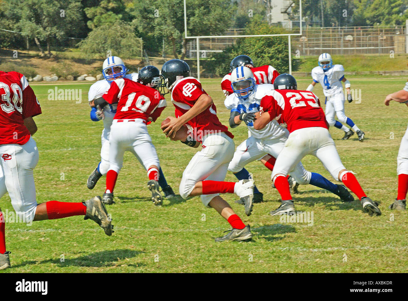 High school football game action Stock Photo - Alamy
