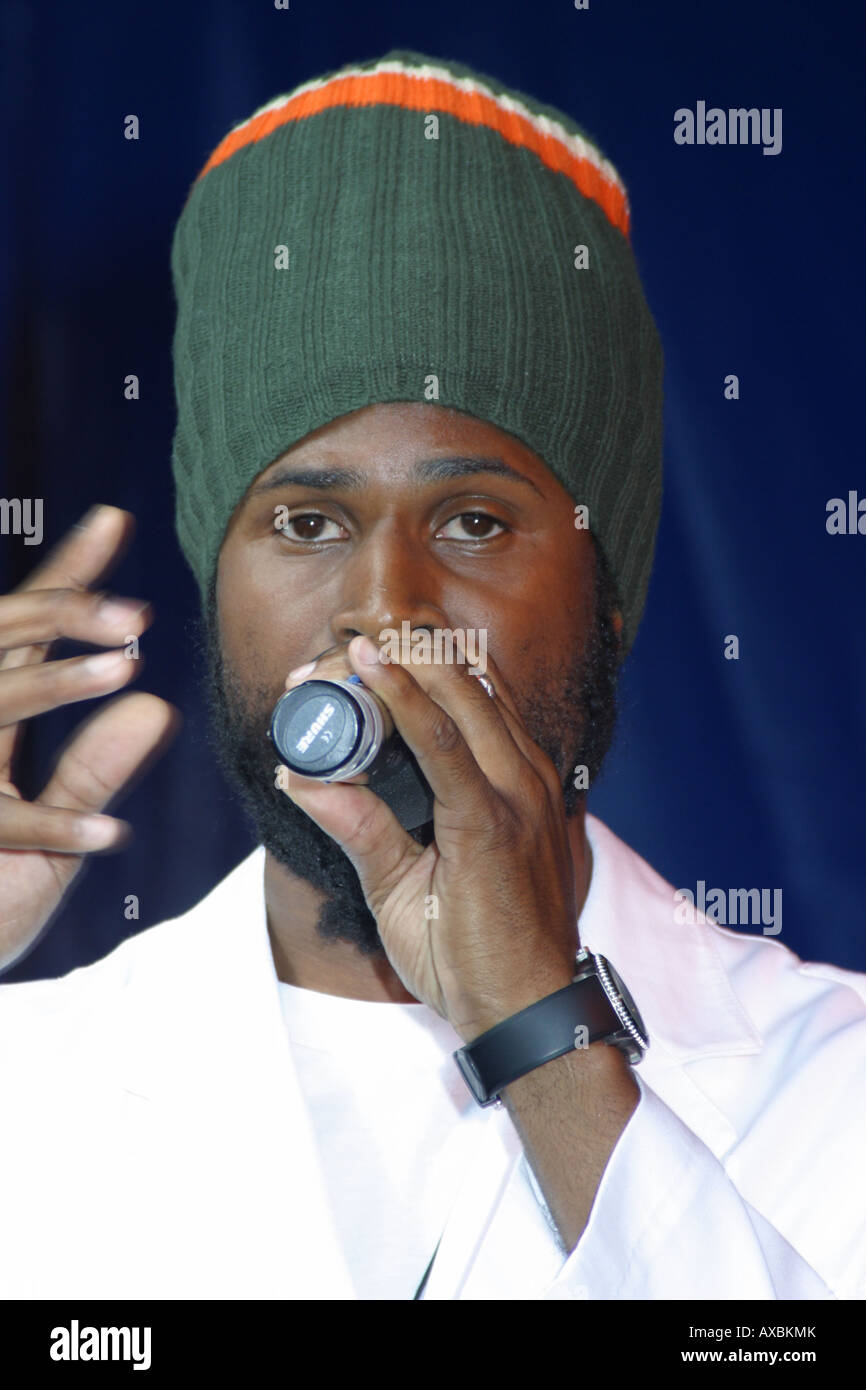 jamaican reggae singer holding microphone singing lambeth country show ...