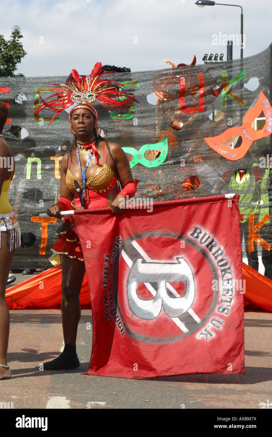 float parade leader banner flag red masks headress notting hill ...