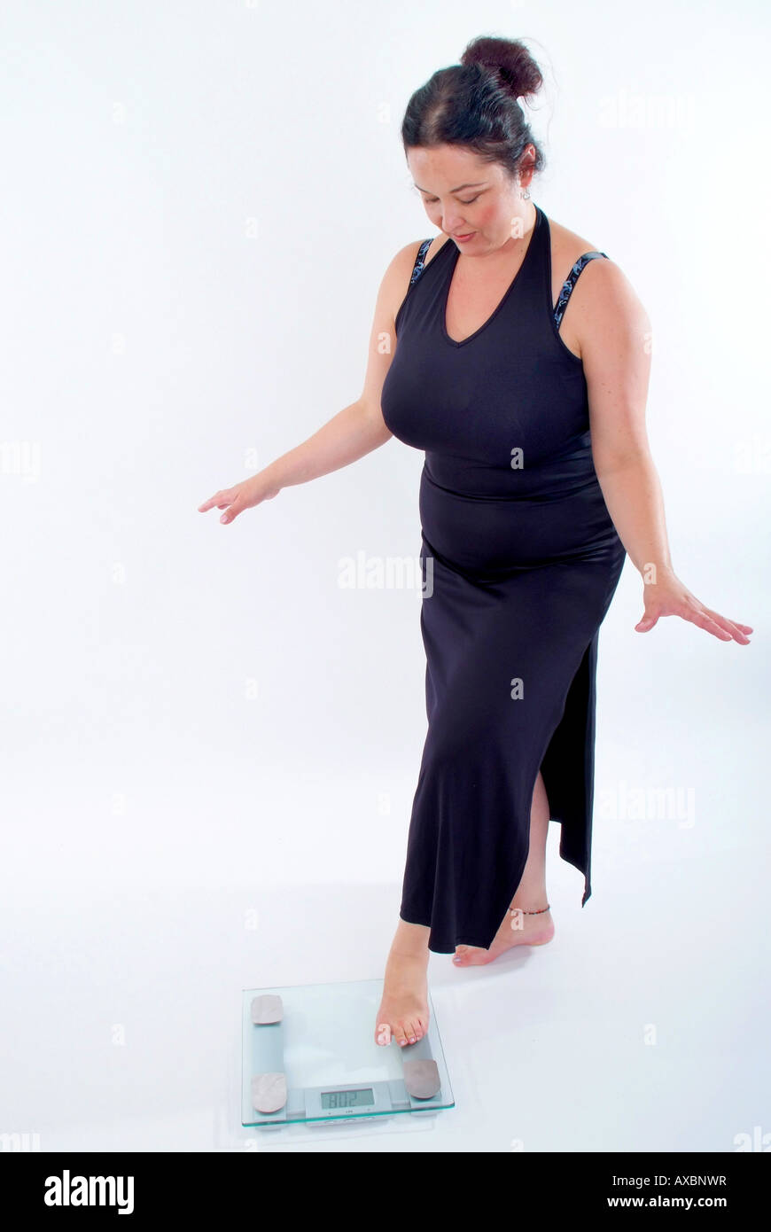 chubby woman on scale Stock Photo - Alamy
