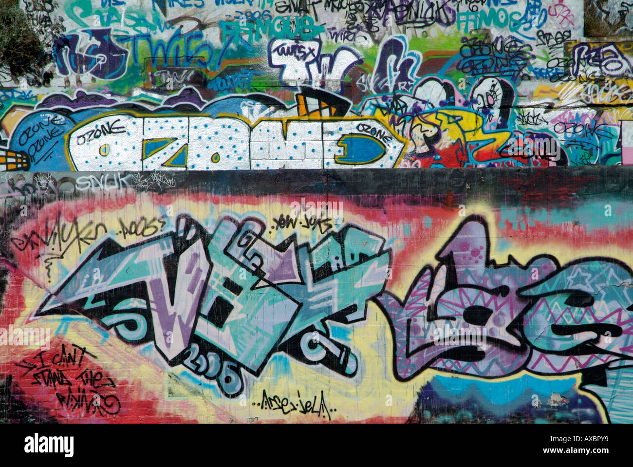 A mass of graffiti sprayed on two walls Stock Photo - Alamy