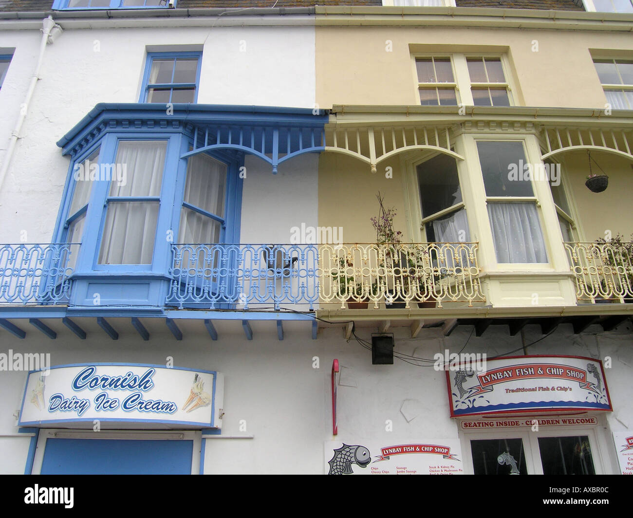 blue yellow balcony of two houses Ilfracombe Devon England Stock Photo ...