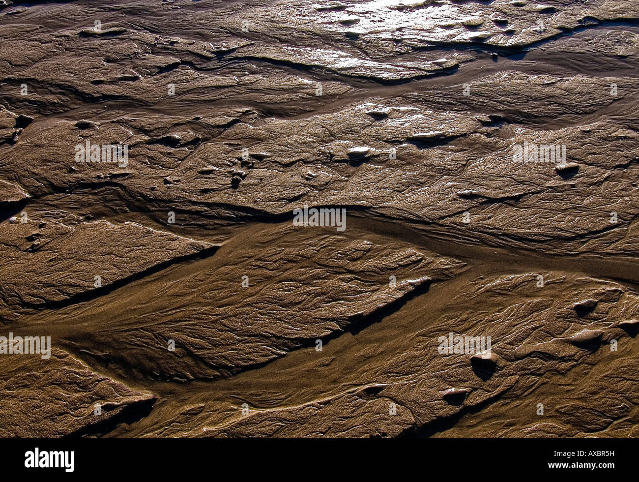 patterns in the sand from a retreating tide Stock Photo - Alamy