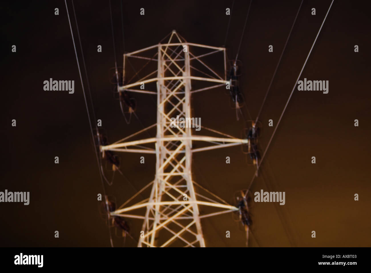 Electrical power tower at night Stock Photo - Alamy